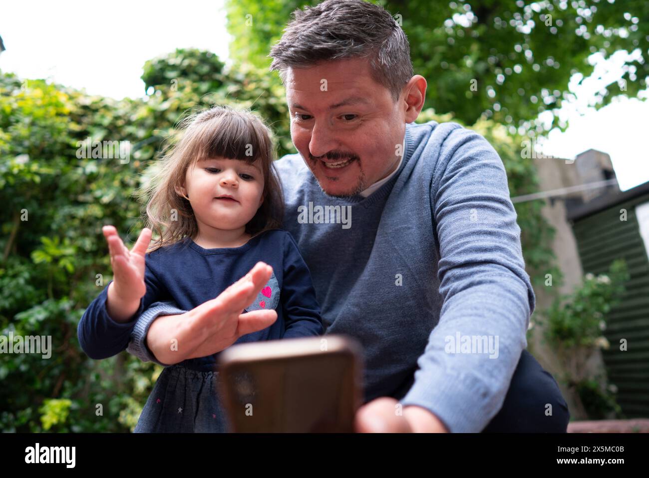 Video call outdoors hi-res stock photography and images - Alamy