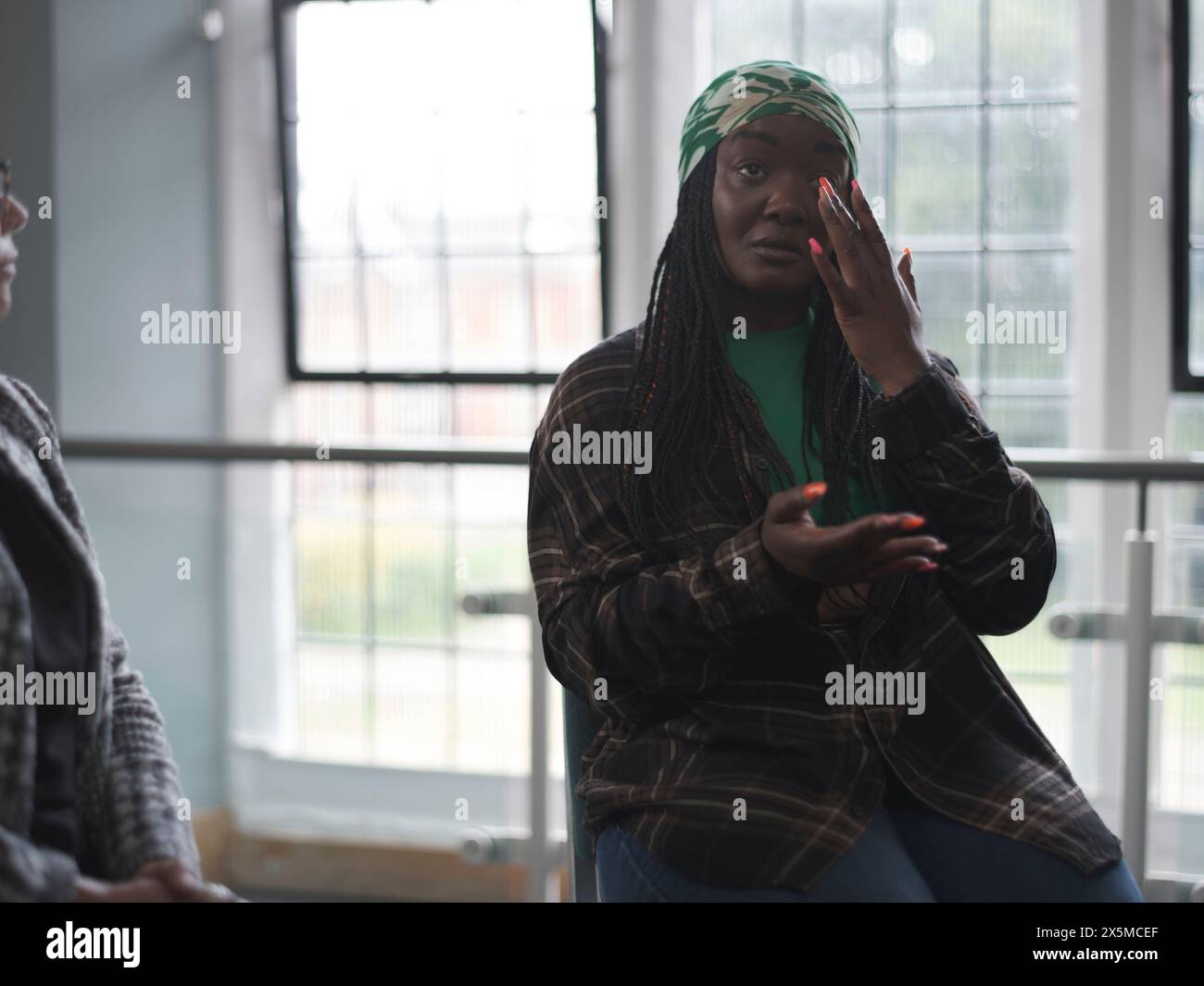 Woman crying in group therapy session Stock Photo - Alamy