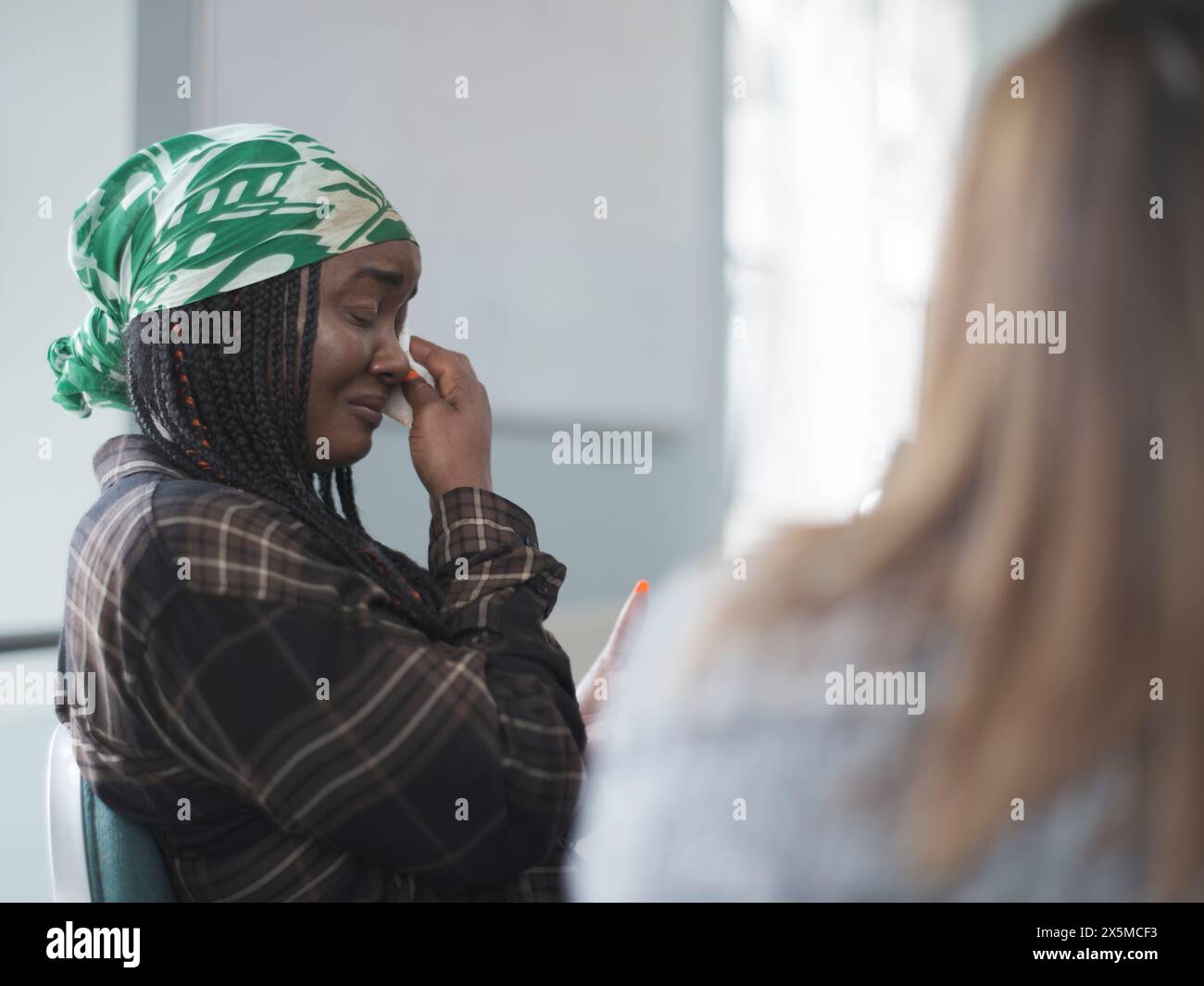Woman crying in group therapy session Stock Photo - Alamy