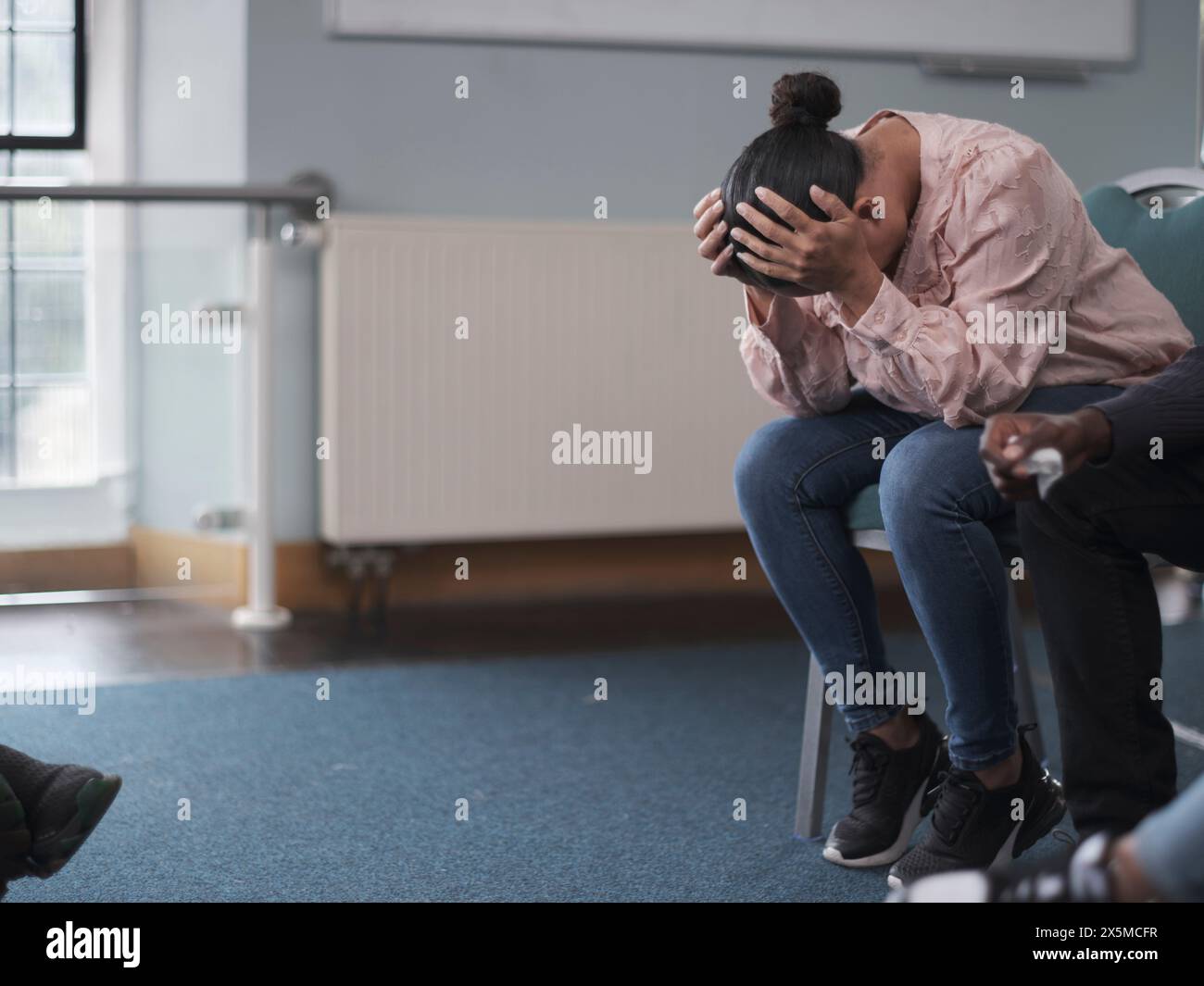 Woman crying in group therapy session Stock Photo - Alamy