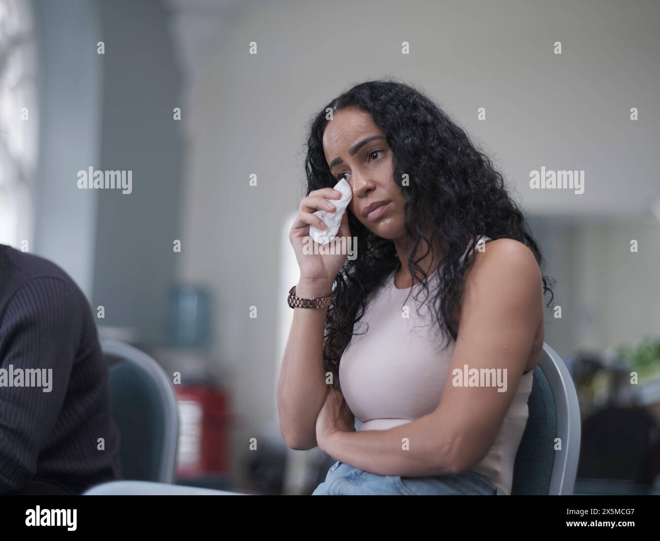 Woman crying in group therapy session Stock Photo - Alamy