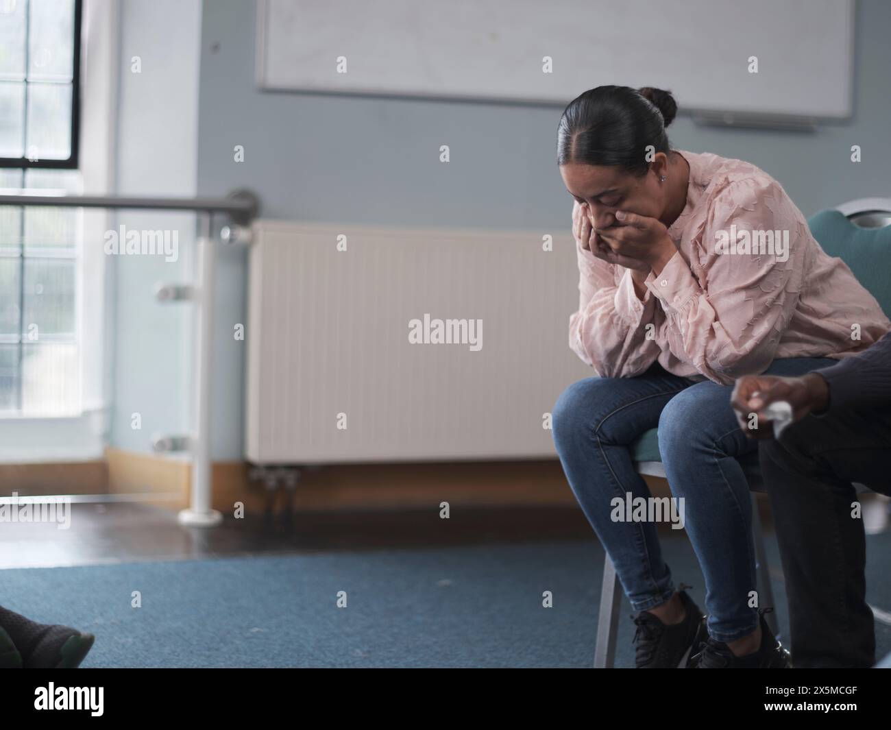 Woman crying in group therapy session Stock Photo - Alamy