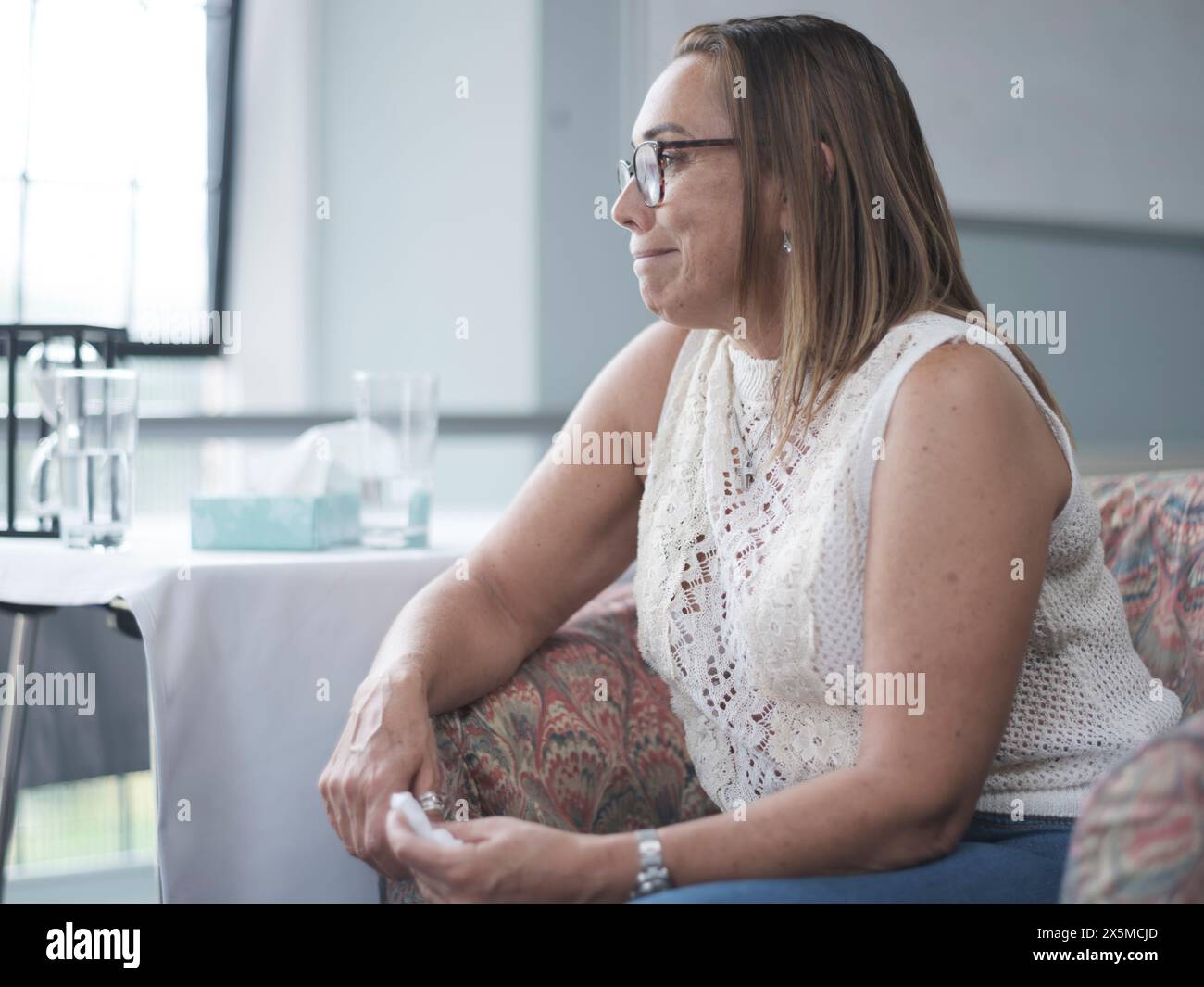 Patient crying in therapy session Stock Photo - Alamy