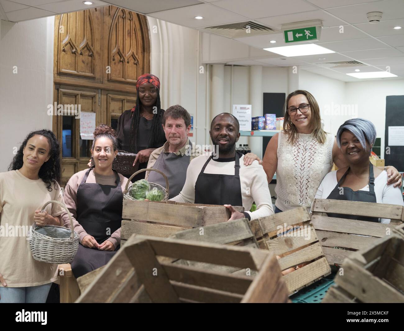Portrait of volunteers in community food center Stock Photo - Alamy