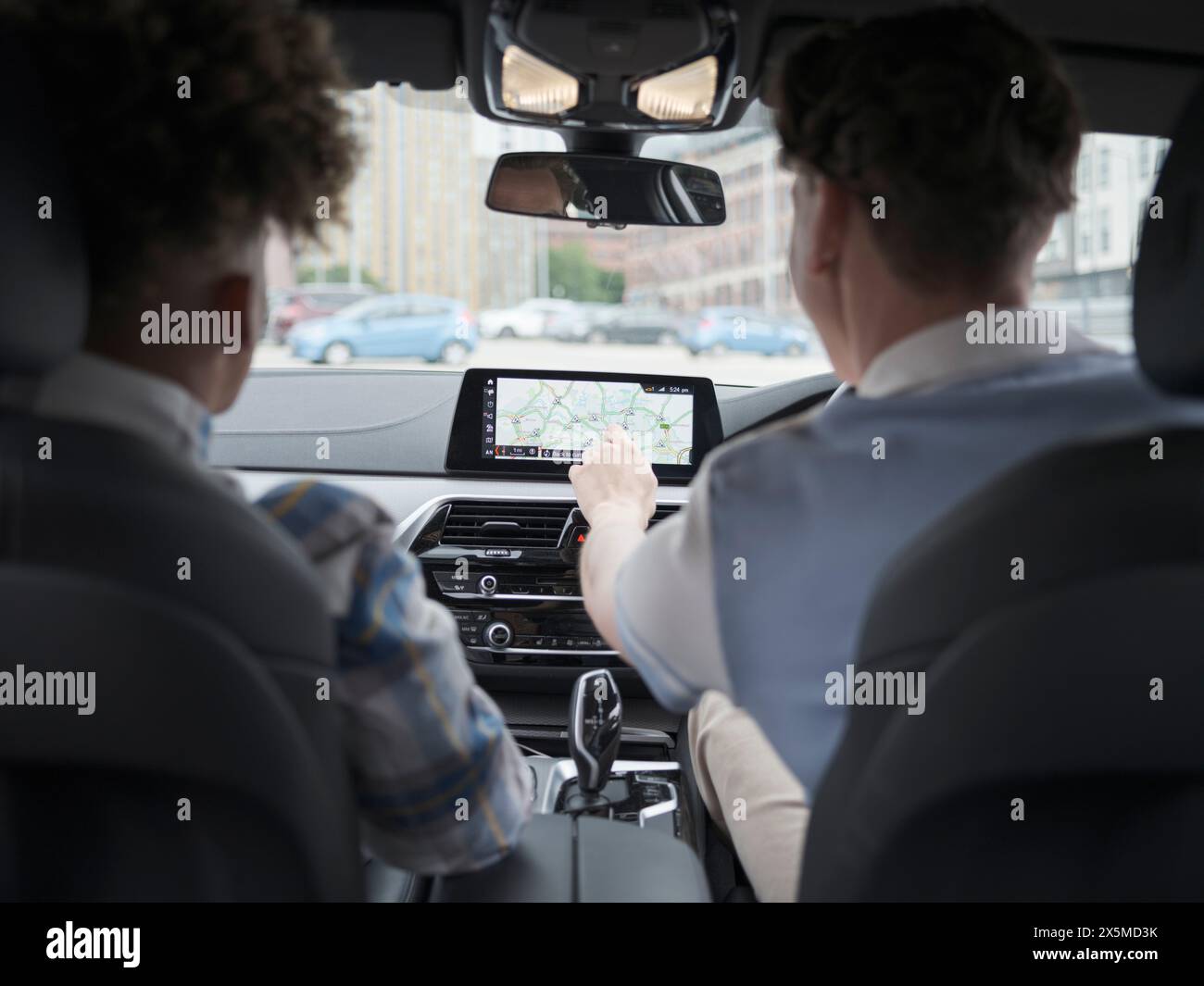 Male couple using gps in car Stock Photo - Alamy