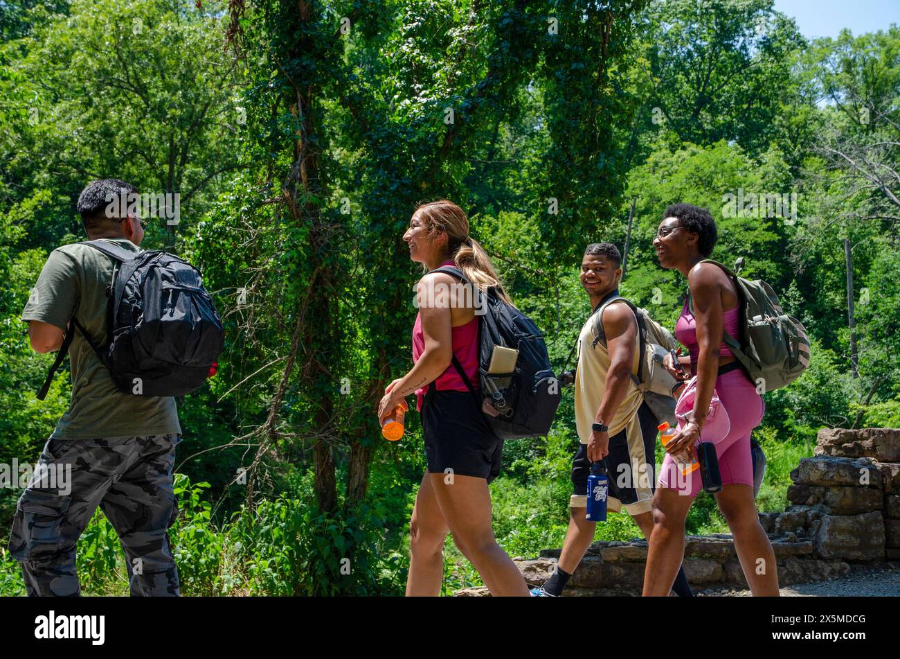 Young people hiking Stock Photo - Alamy