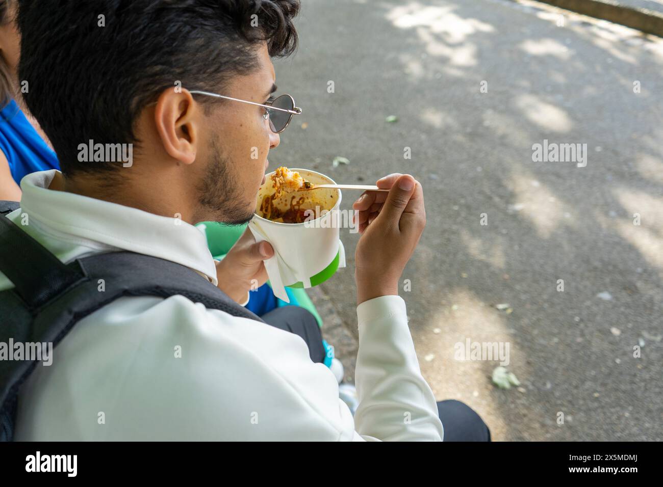 Man eating street food Stock Photo - Alamy