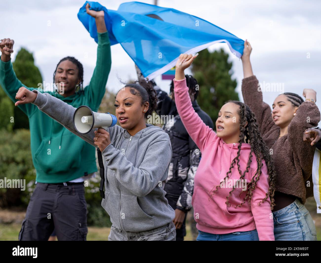 Group of teenage (16-17) friends taking part in protest Stock Photo - Alamy