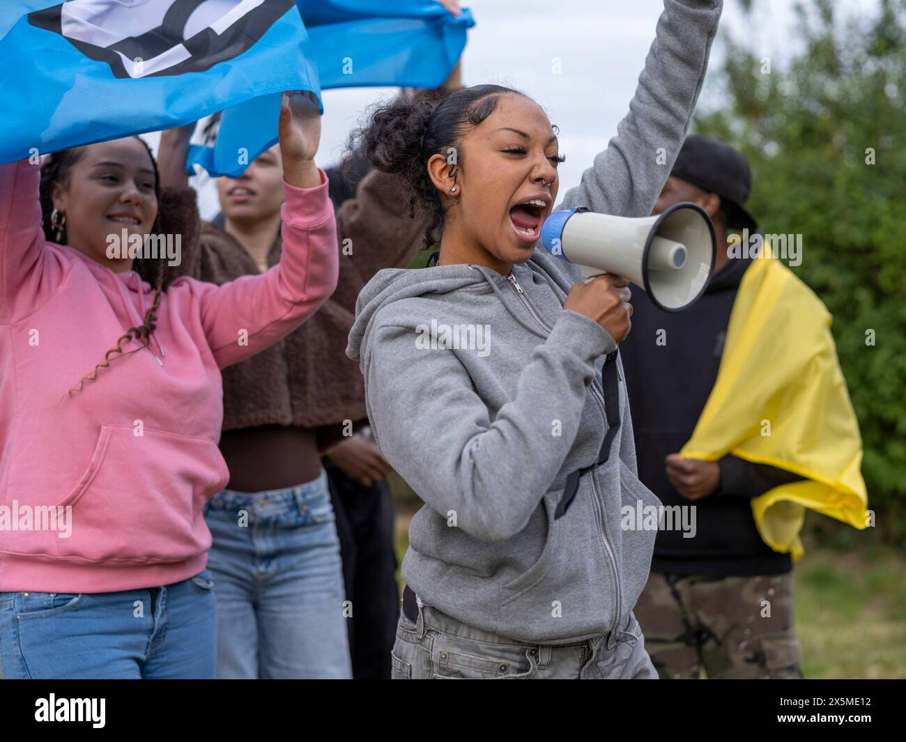 Group of teenage (16-17) friends taking part in protest Stock Photo - Alamy