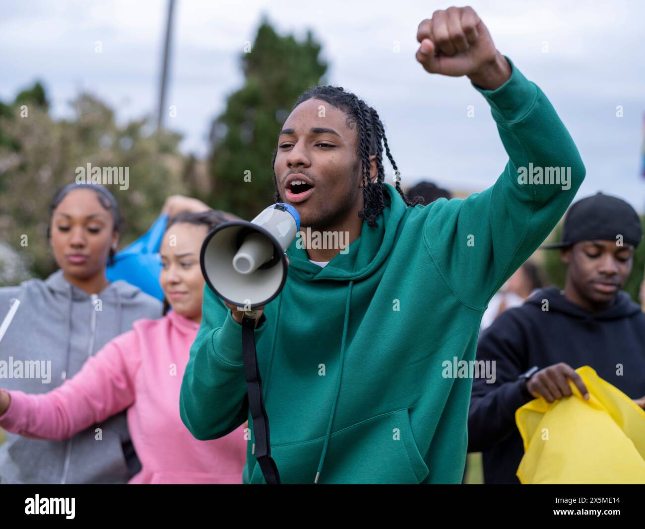 Group of teenage (16-17) friends taking part in protest Stock Photo - Alamy