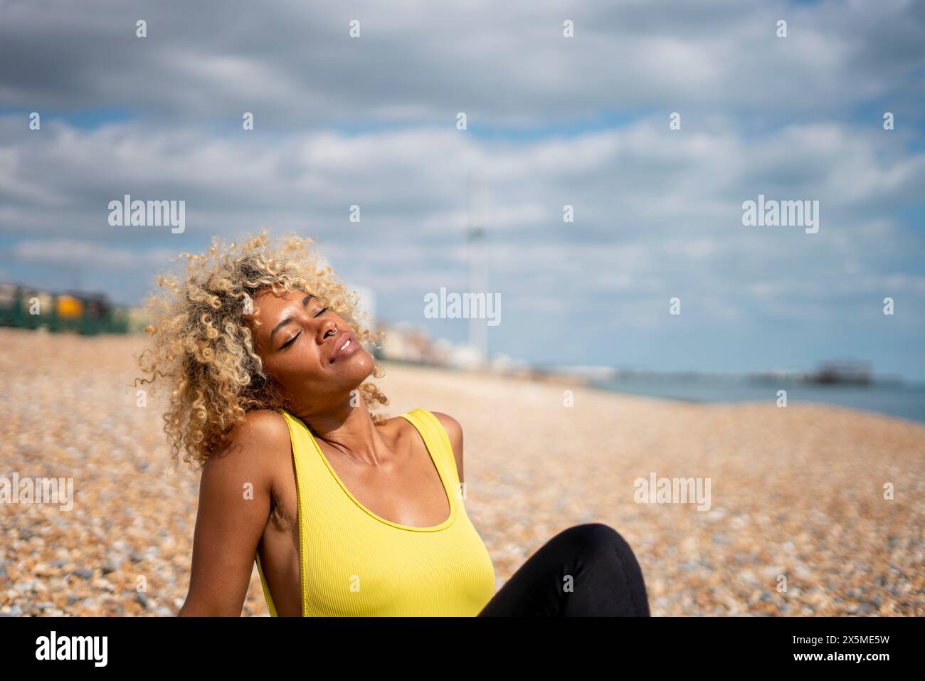 Mature woman sunbathing beach hi-res stock photography and images - Alamy