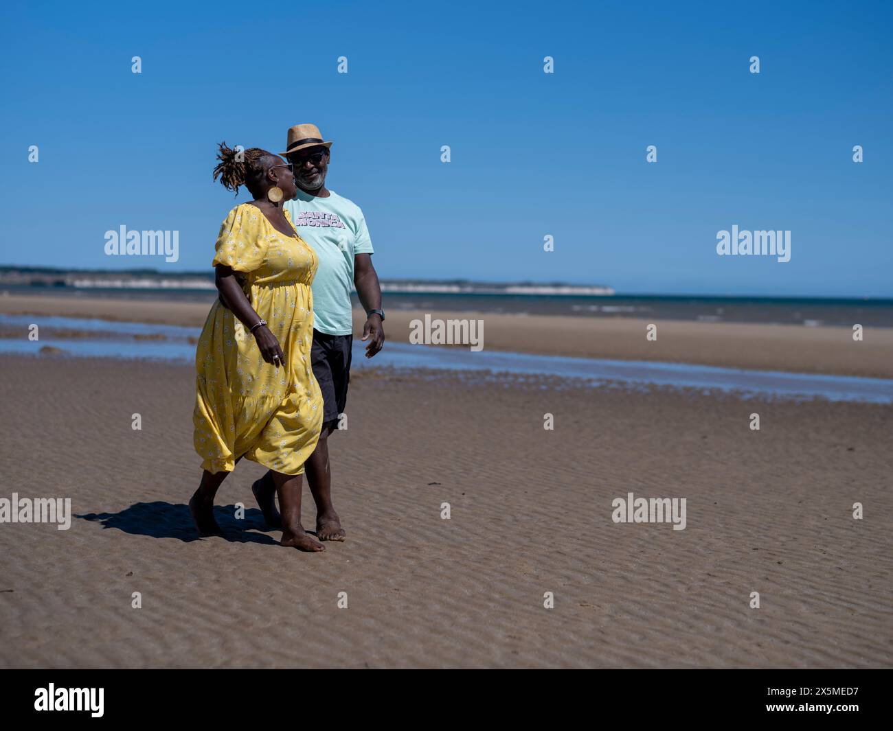 Couple beach walking on hi-res stock photography and images - Alamy
