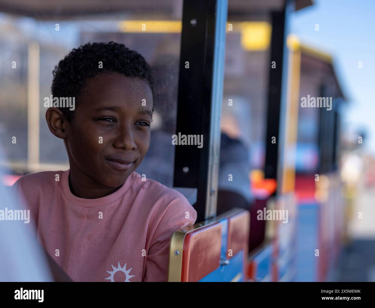 Boy (8-9) on land train tourist ride Stock Photo - Alamy
