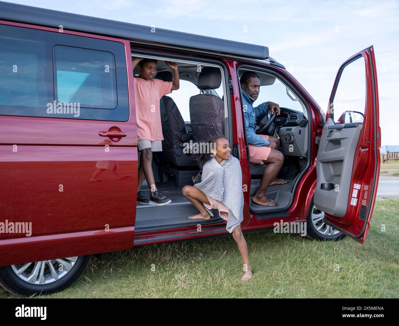 Father with children (6-7, 8-9) in van Stock Photo - Alamy