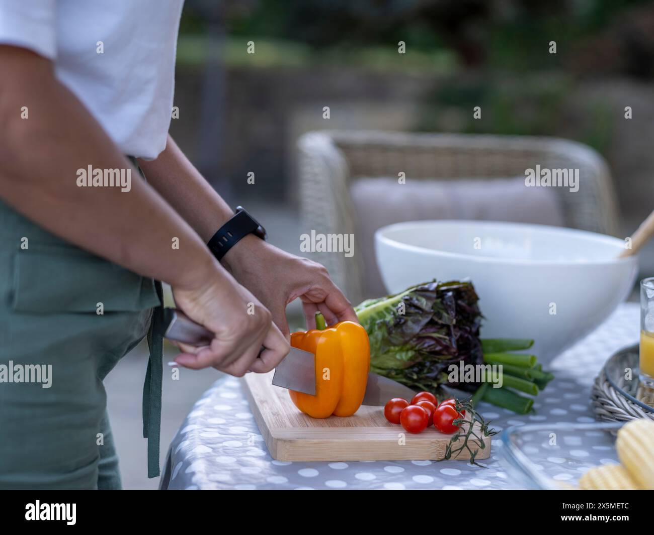 Woman cutting vegetables Stock Photo - Alamy