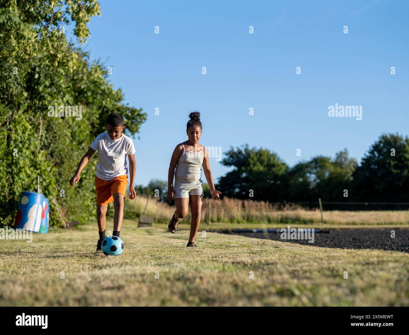 Adolescent boys playing soccer hi-res stock photography and images - Alamy