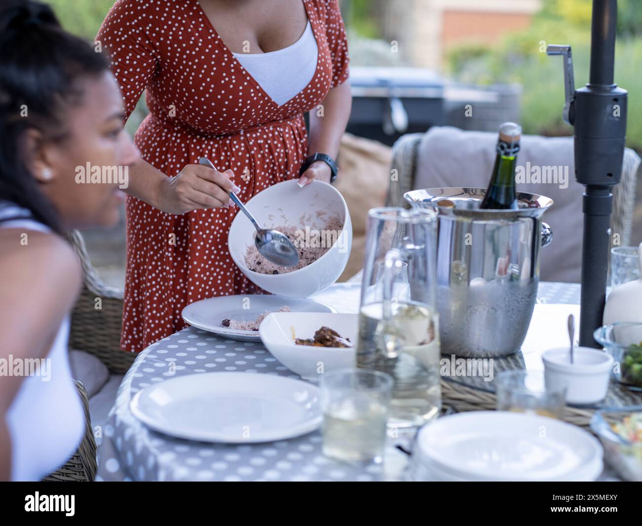 Women having dinner outdoors Stock Photo - Alamy