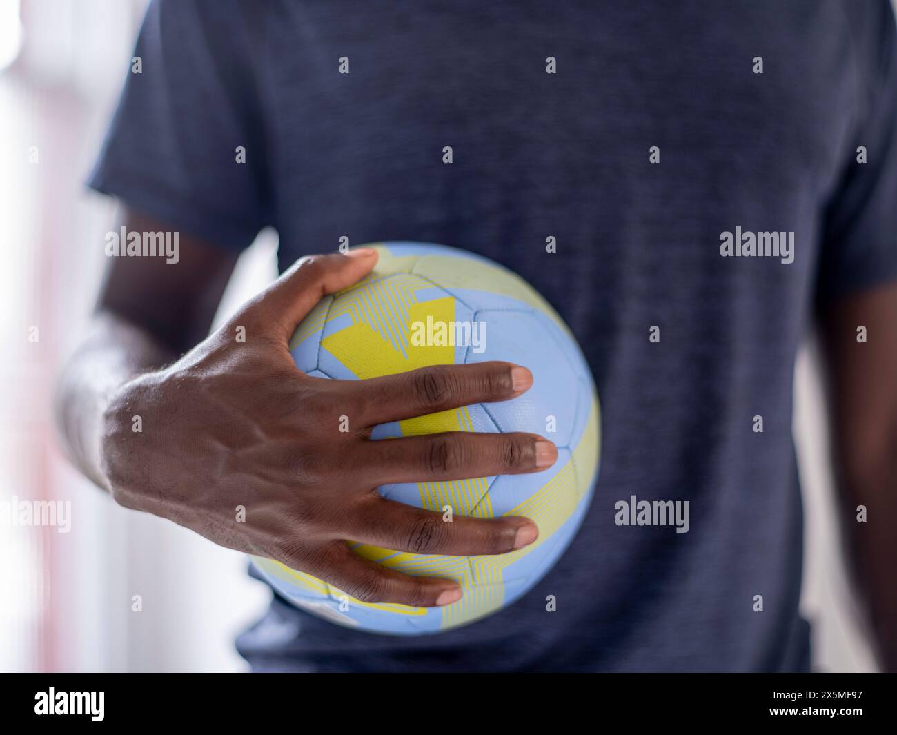 Athlete holding ball hi-res stock photography and images - Alamy