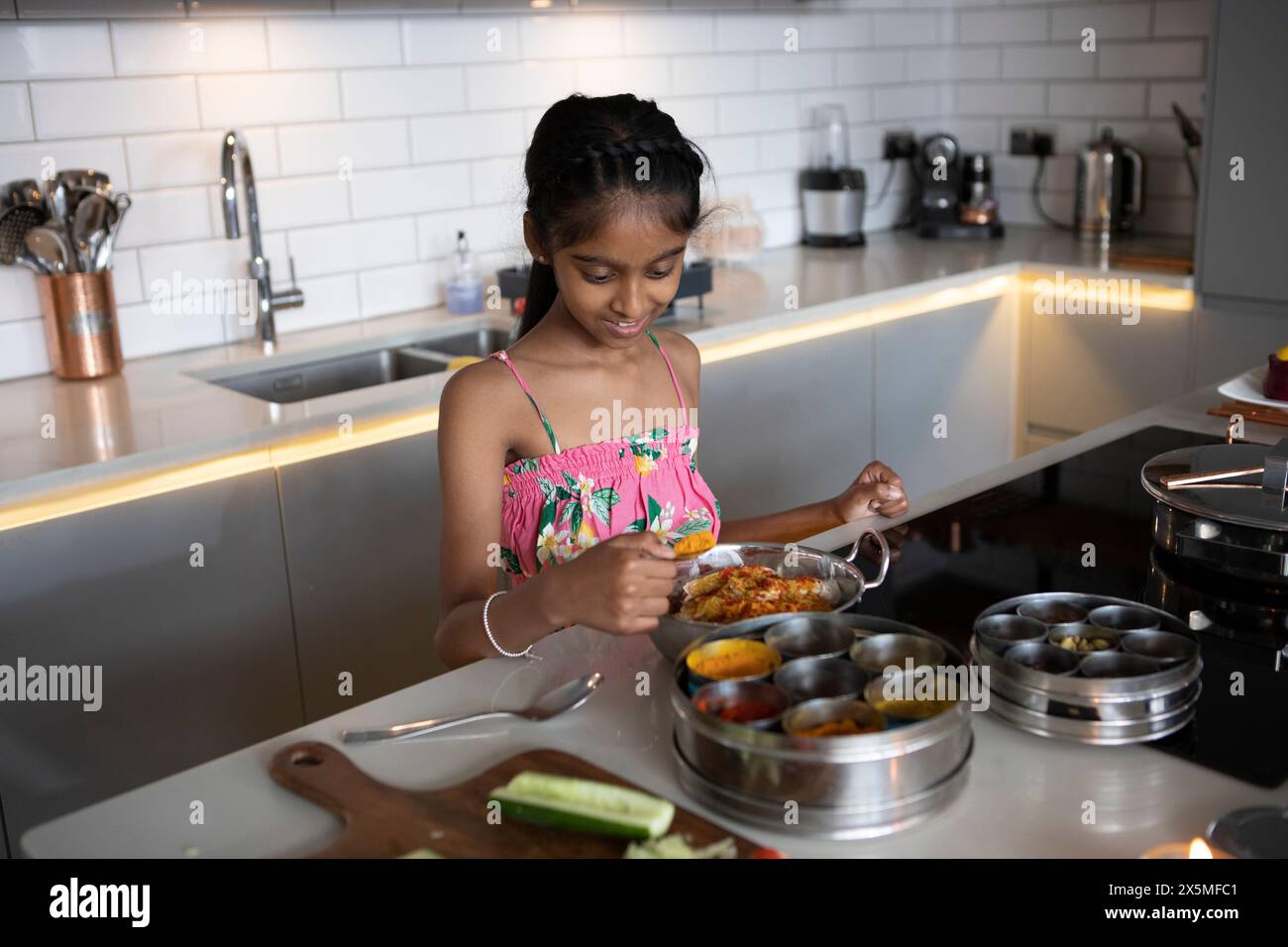 Indian girl cooking hi-res stock photography and images - Alamy