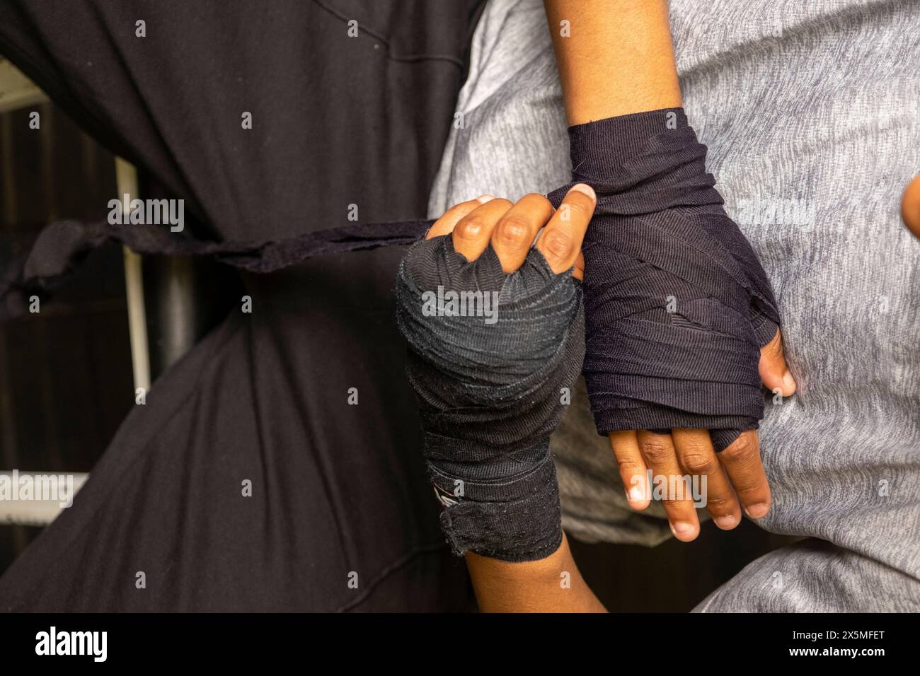 Young woman wrapping hands for boxing match, close up Stock Photo - Alamy