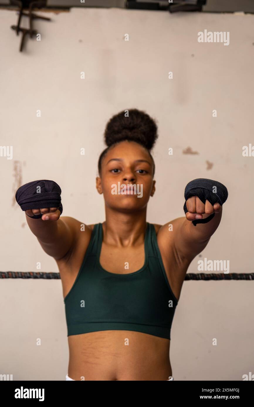 Portrait of young woman with hand wrap Stock Photo - Alamy