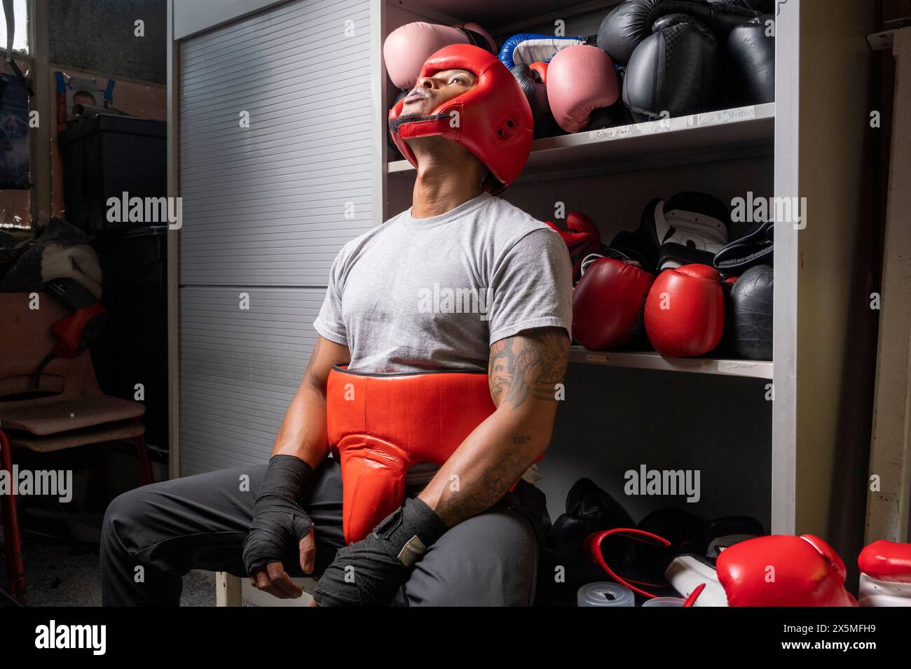 Mature man sitting in locker room before boxing match Stock Photo - Alamy