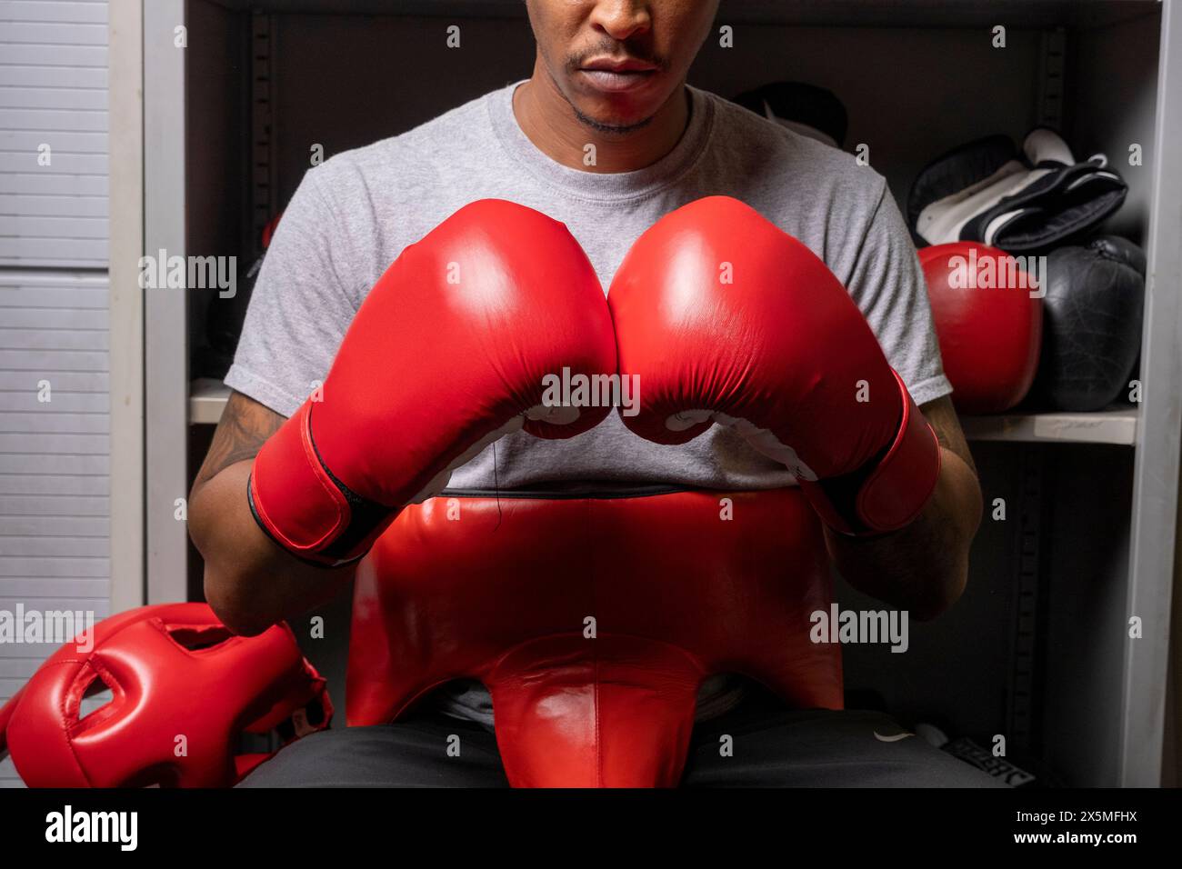 Mature man in boxing gloves, midsection Stock Photo - Alamy