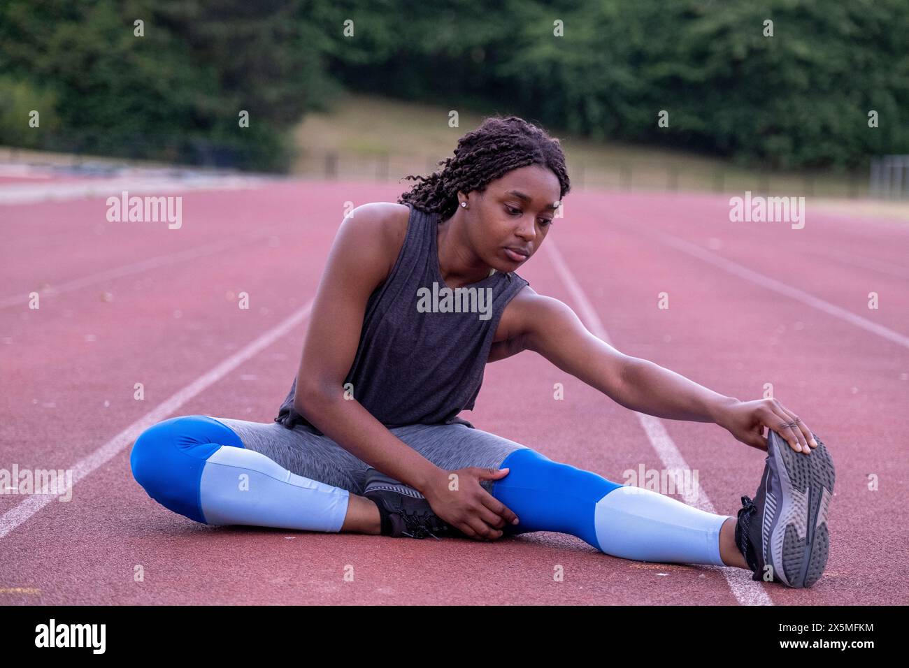 Running stretching woman stretching leg hi-res stock photography and ...