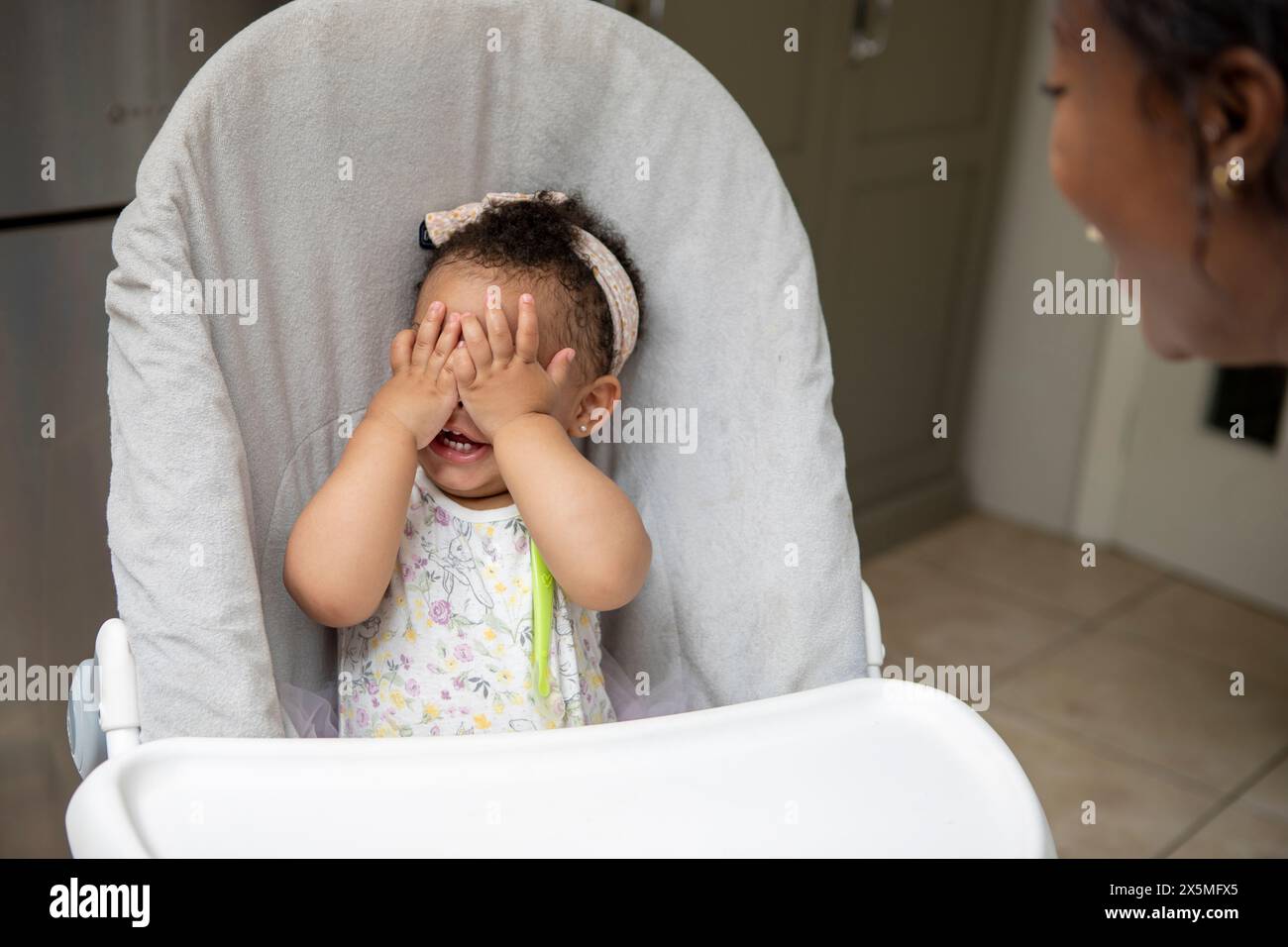 Adult playing peekaboo with baby hi-res stock photography and images ...