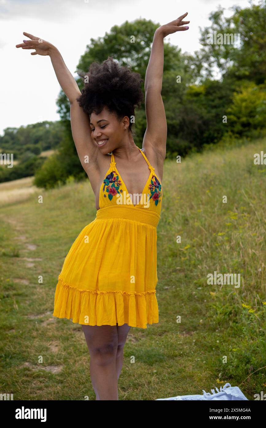 Woman dancing in meadow hi-res stock photography and images - Alamy