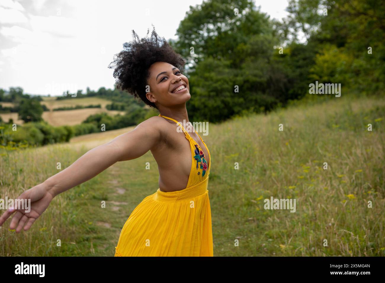 Woman dancing in meadow hi-res stock photography and images - Alamy