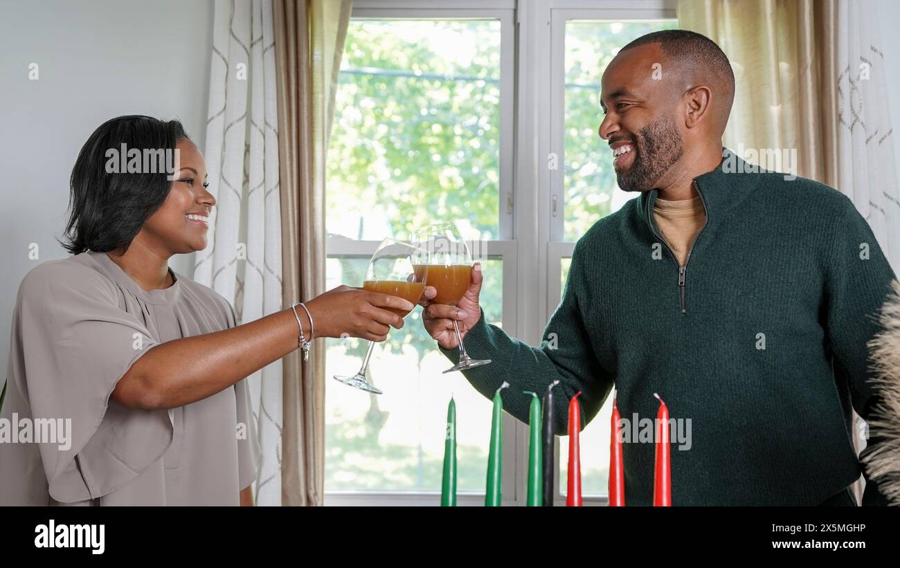 Mature couple raising toast hi-res stock photography and images - Alamy