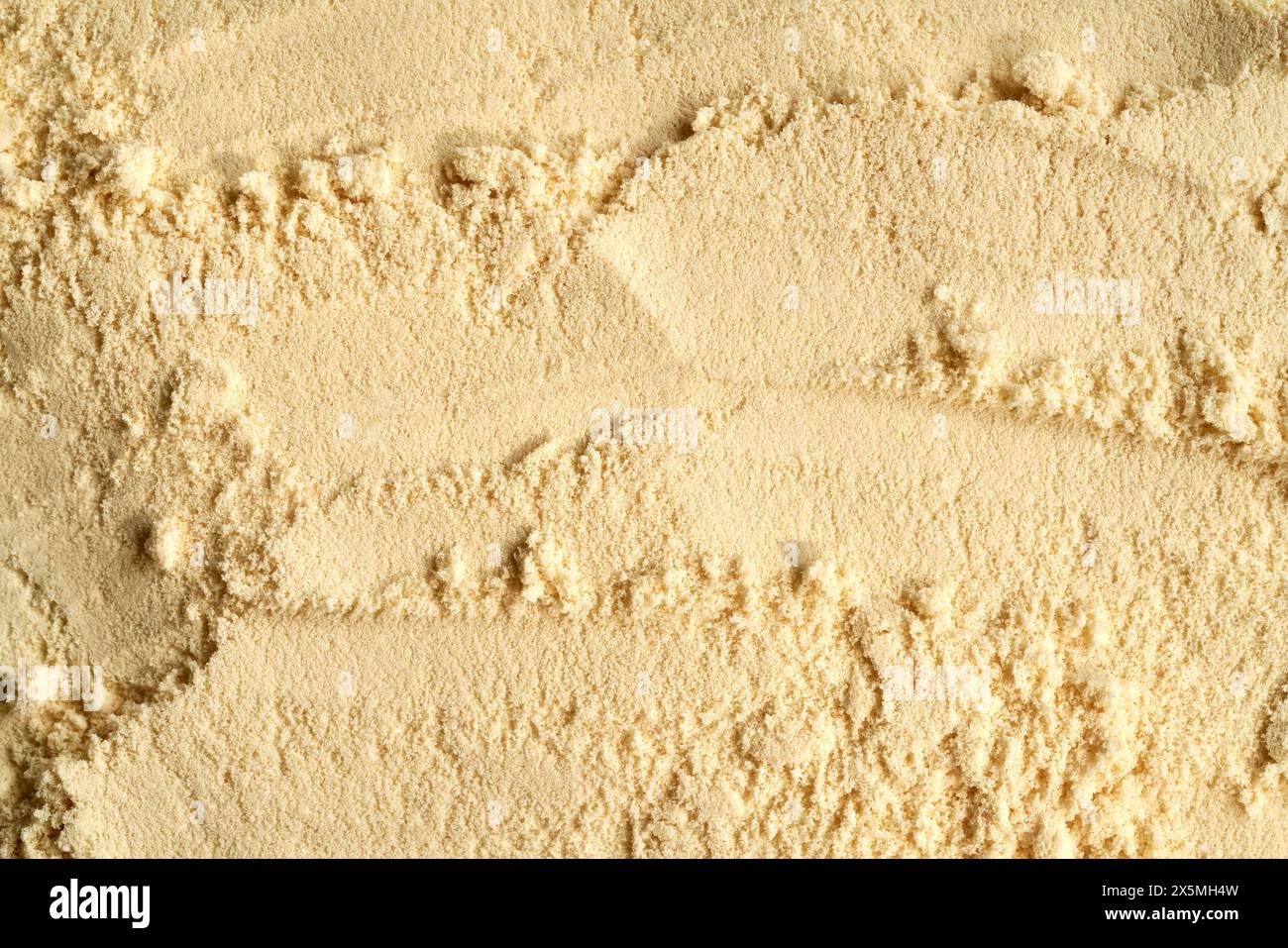Beige background made of whey protein powder - healthy nutritional ...