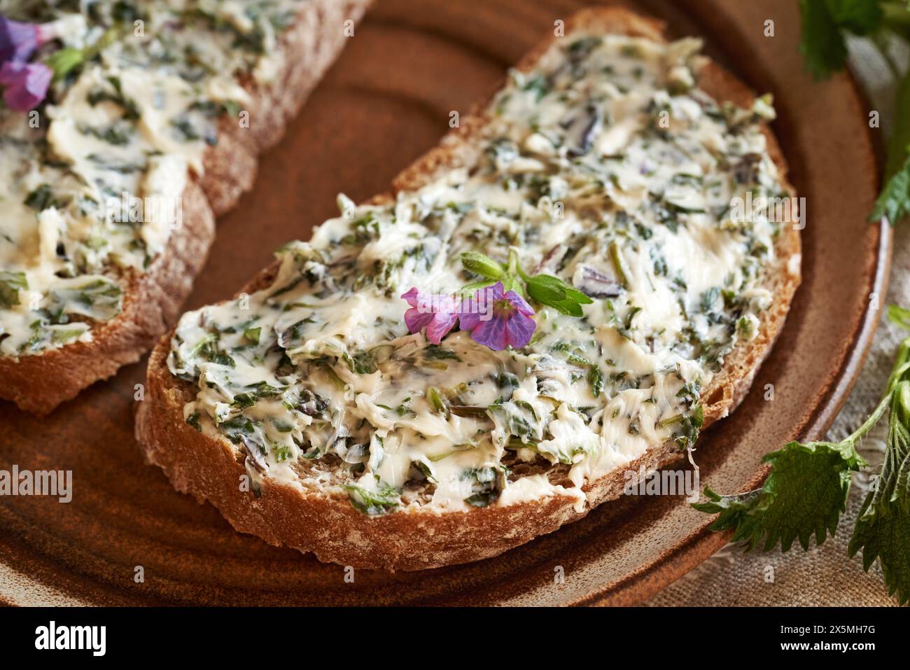 A slice of bread with nettle butter - homemade spread made of wild ...