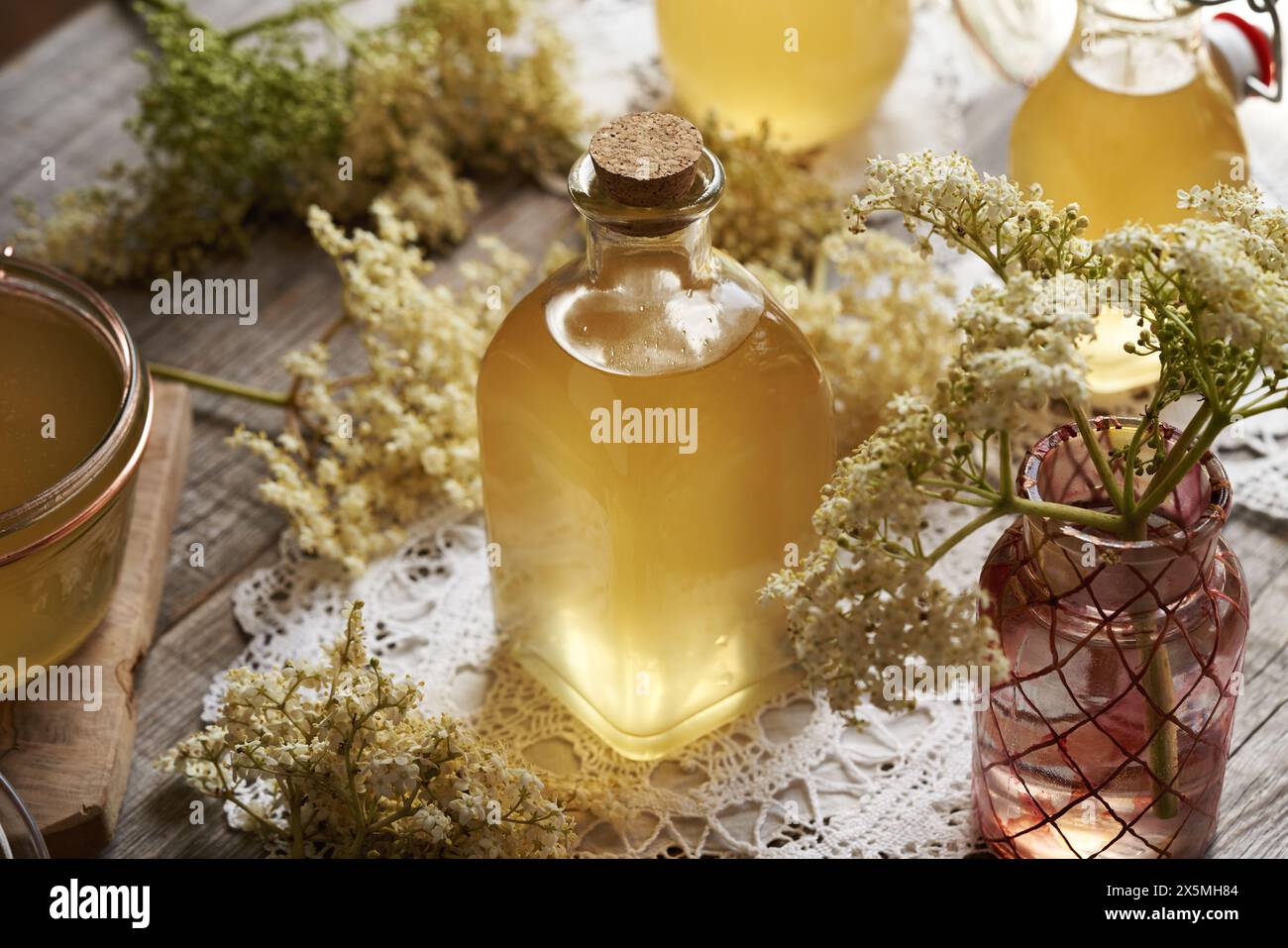 Homemade elderberry flower syrup in a transparent glass bottle Stock ...