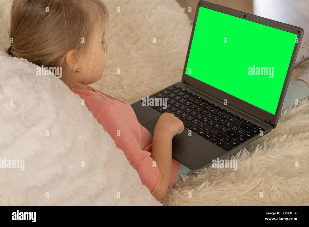preschool girl studying distance learning course, using computer for ...