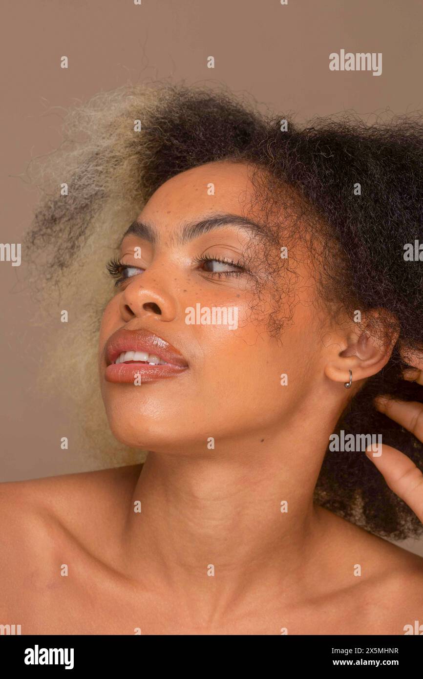 Studio portrait of woman with two toned hair Stock Photo - Alamy
