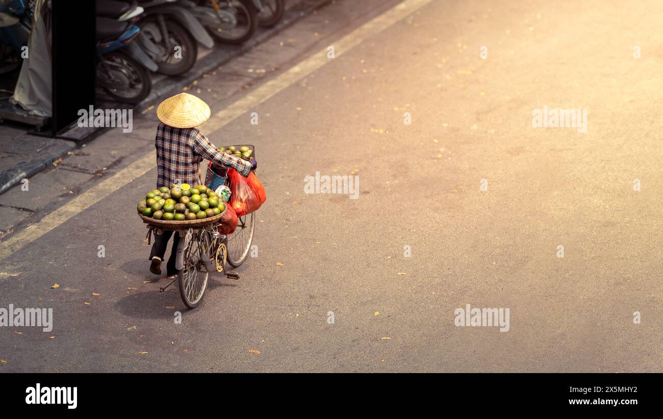 Aerial view of Vietnamese street vendor woman wearing a traditional ...