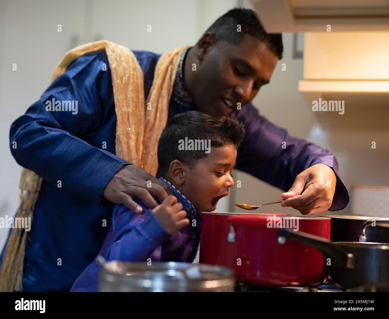 Child tasting indian food hi-res stock photography and images - Alamy