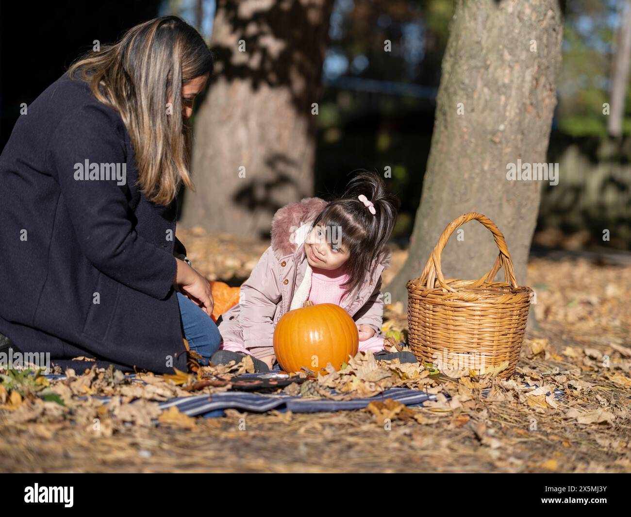Mother and daughter with Down syndrome playing in park Stock Photo - Alamy