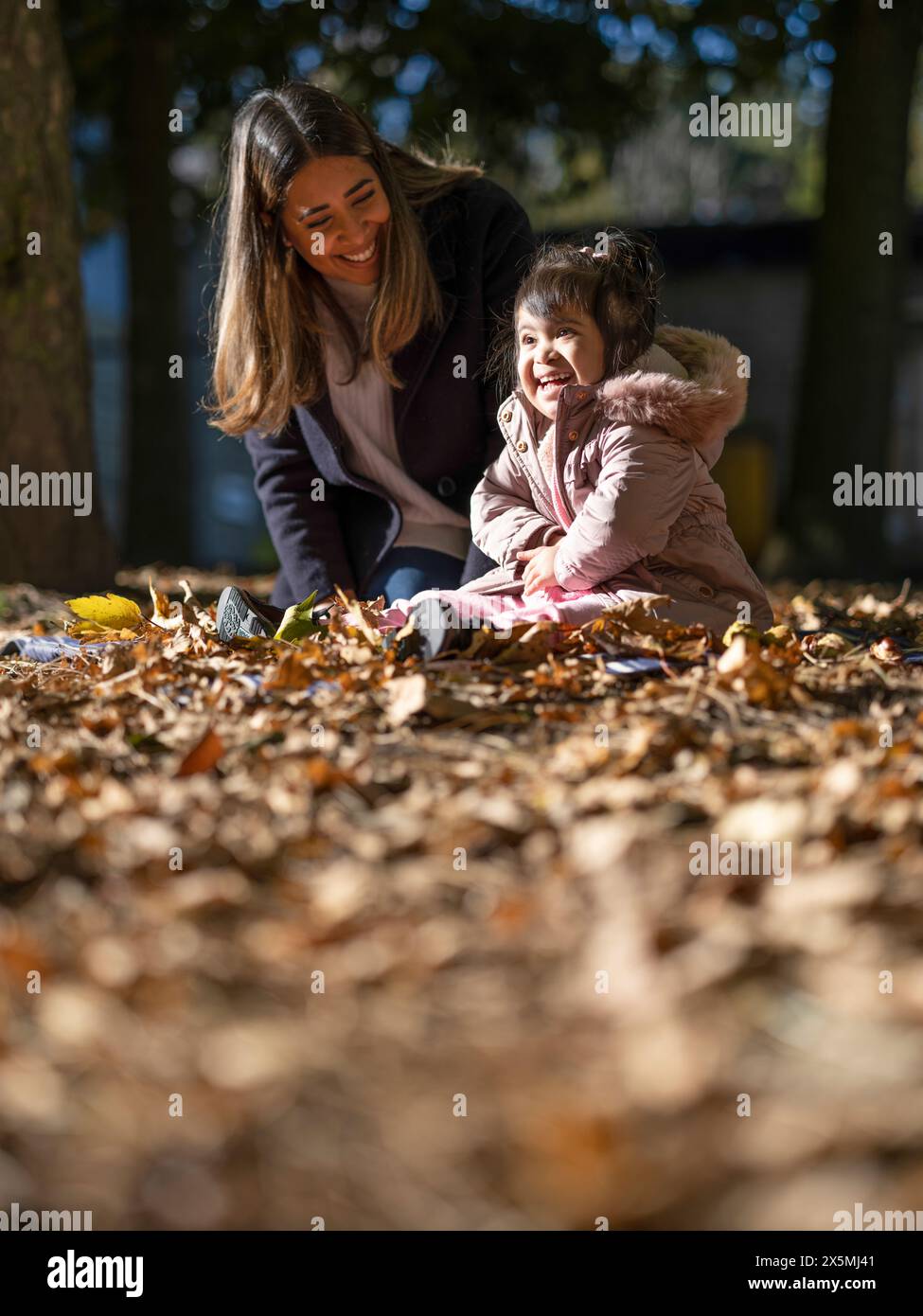Mother and daughter with Down syndrome playing in park Stock Photo - Alamy