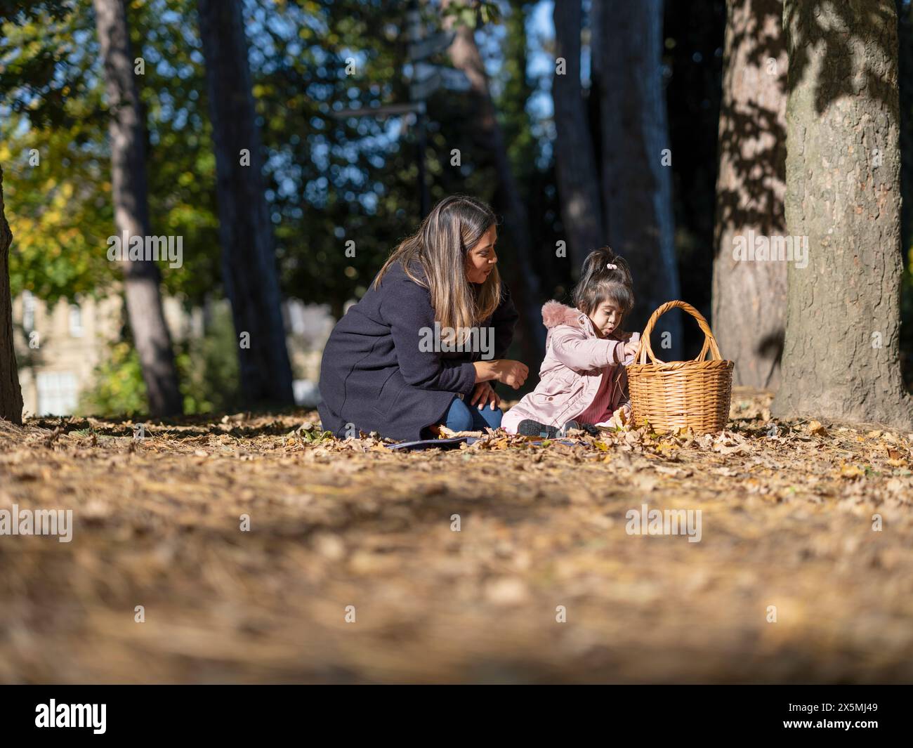 Mother and daughter with Down syndrome playing in park Stock Photo - Alamy