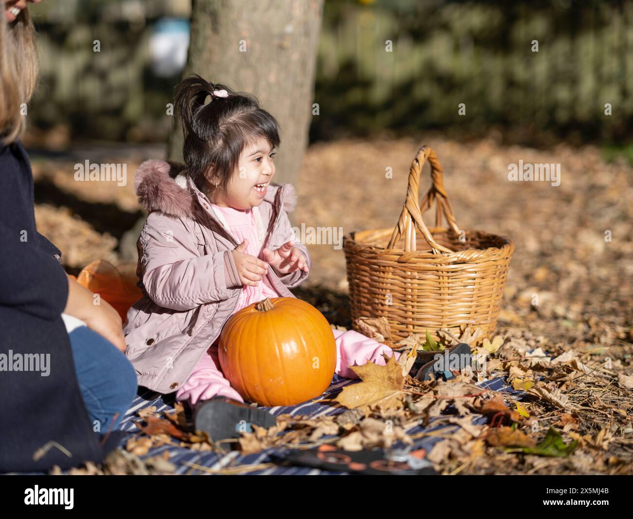 Mother and daughter with Down syndrome playing in park Stock Photo - Alamy