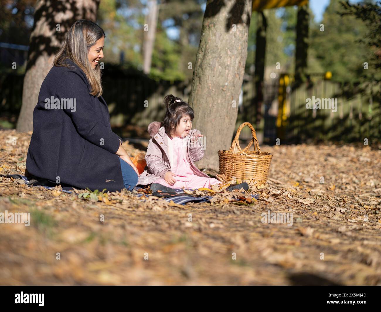 Mother and daughter with Down syndrome playing in park Stock Photo - Alamy