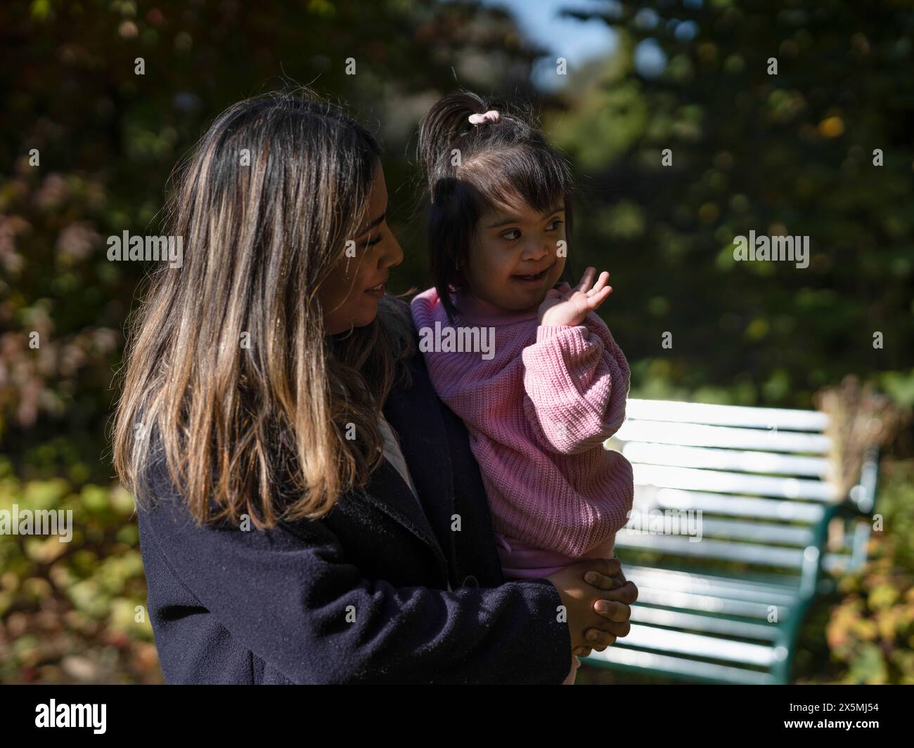 Mother holding daughter with Down syndrome Stock Photo - Alamy