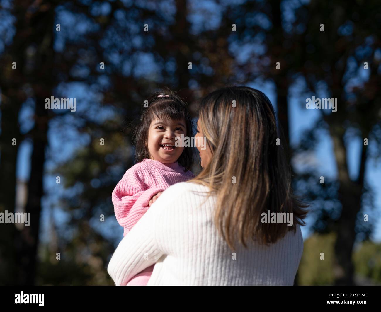 Mother hugging daughter with Down syndrome Stock Photo - Alamy