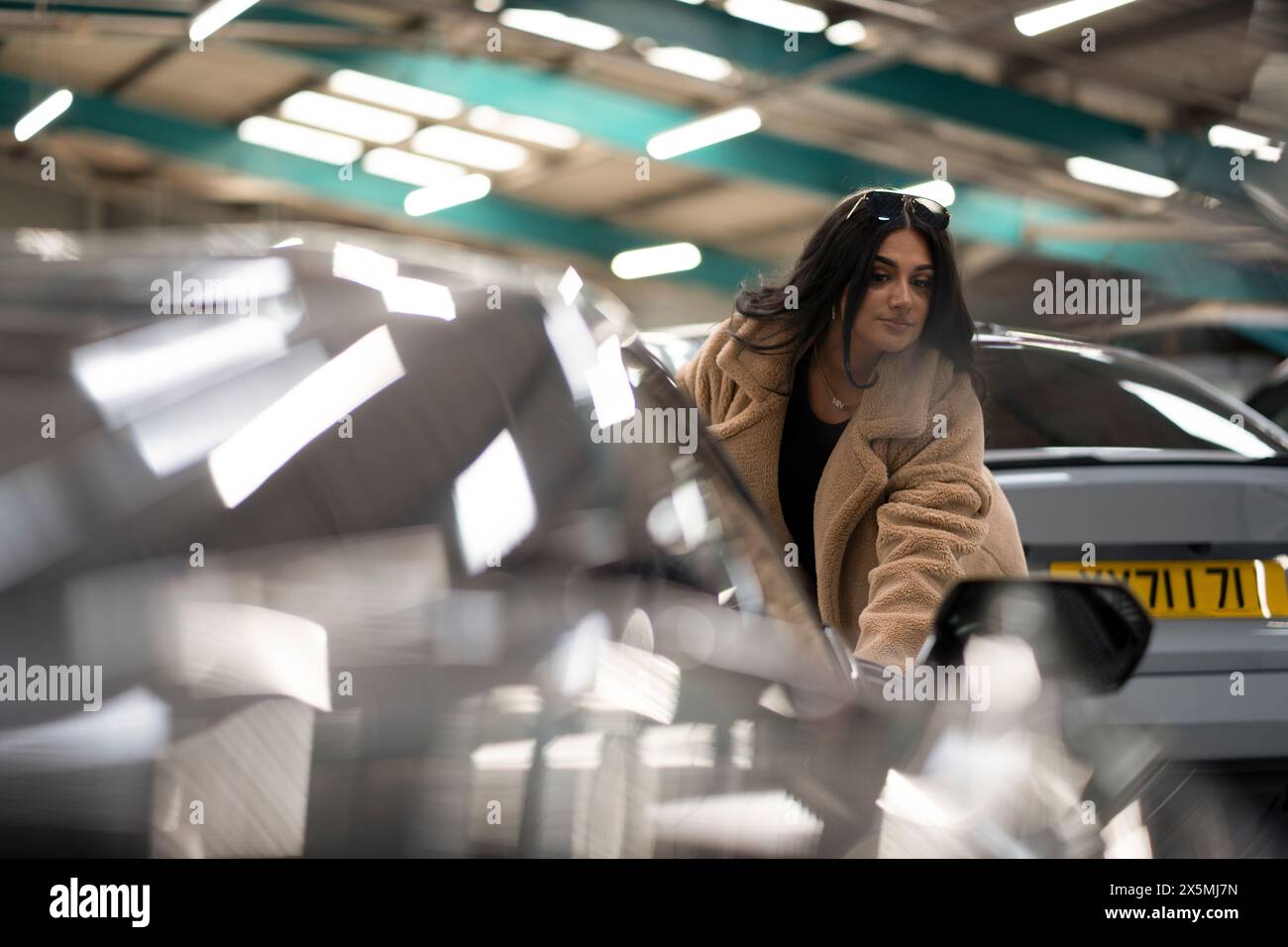 Woman touching luxury car hi-res stock photography and images - Alamy