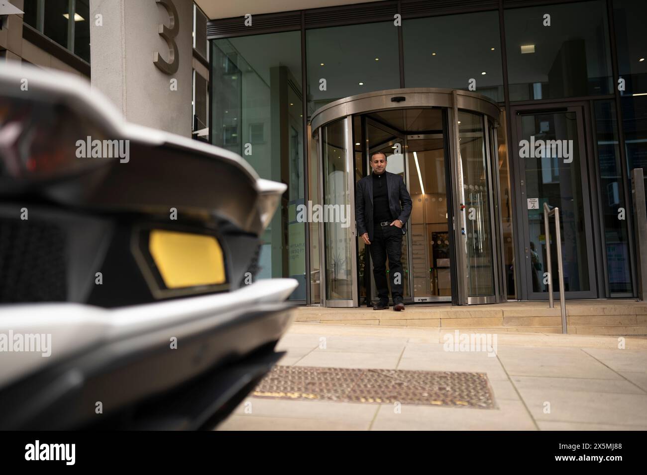 Mature man leaving luxury building Stock Photo - Alamy