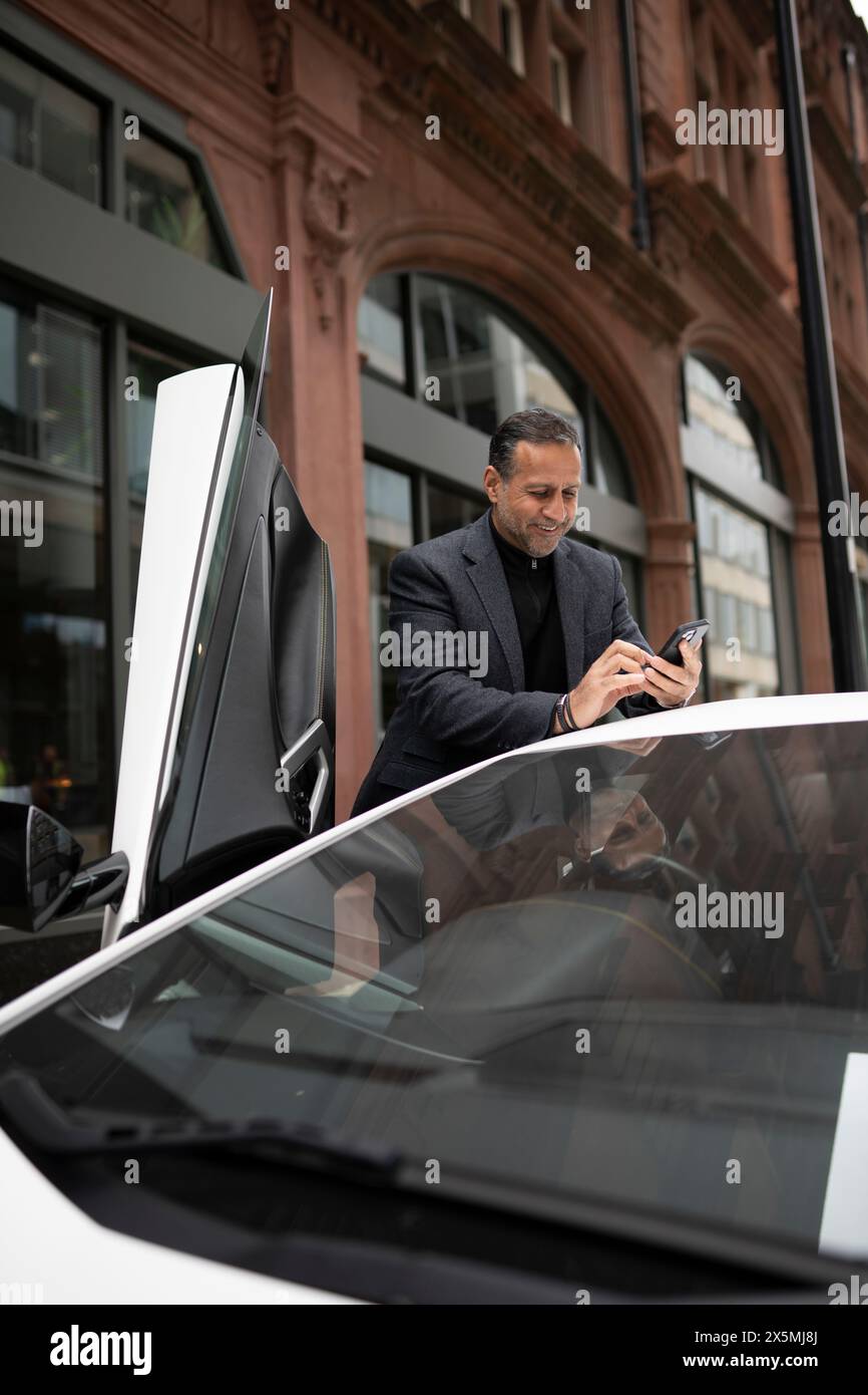 Man standing car using hi-res stock photography and images - Alamy