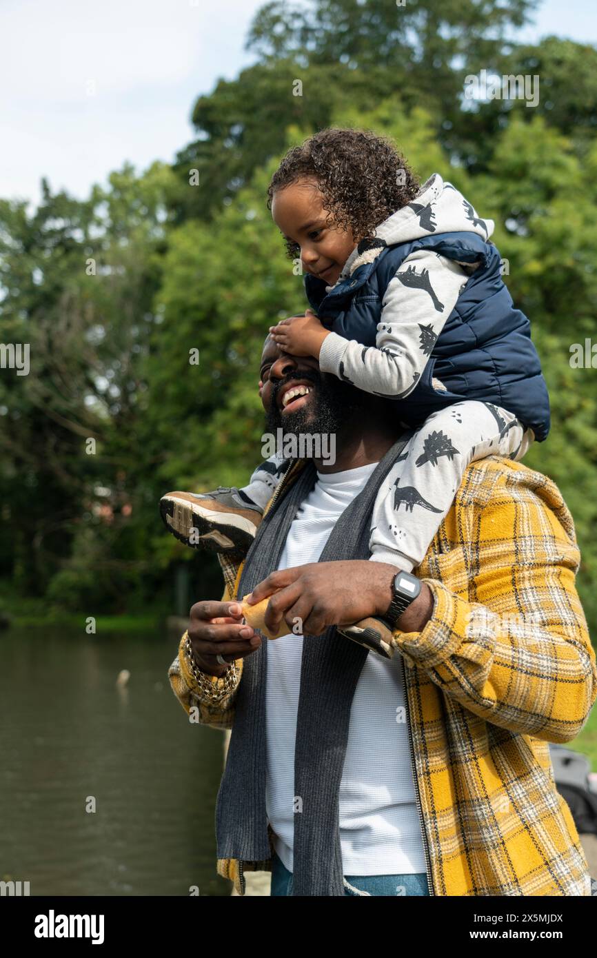 Man with child on his shoulders hi-res stock photography and images - Alamy